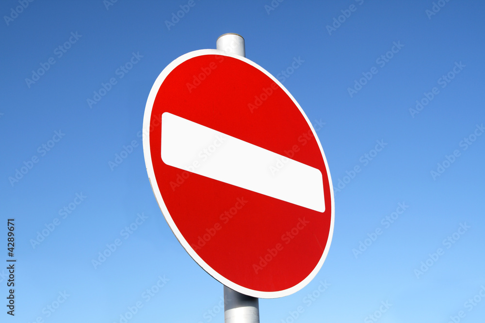 Red and white british no entry road sign with a blue sky. Stock Photo ...