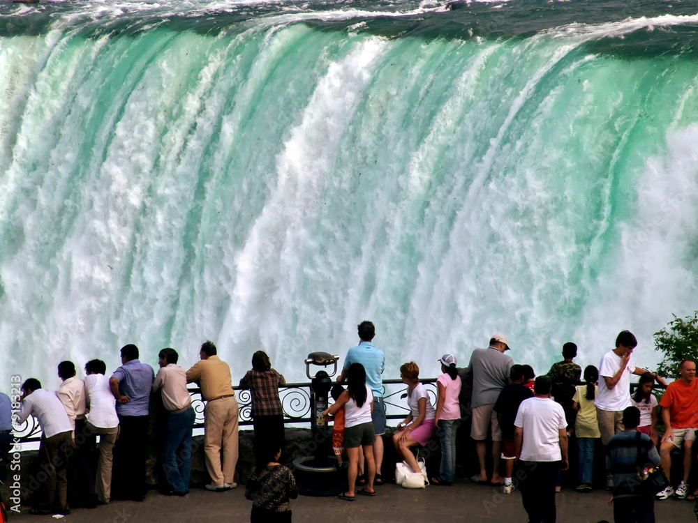 Photo Stock People on falling water background. Niagara Falls | Adobe Stock