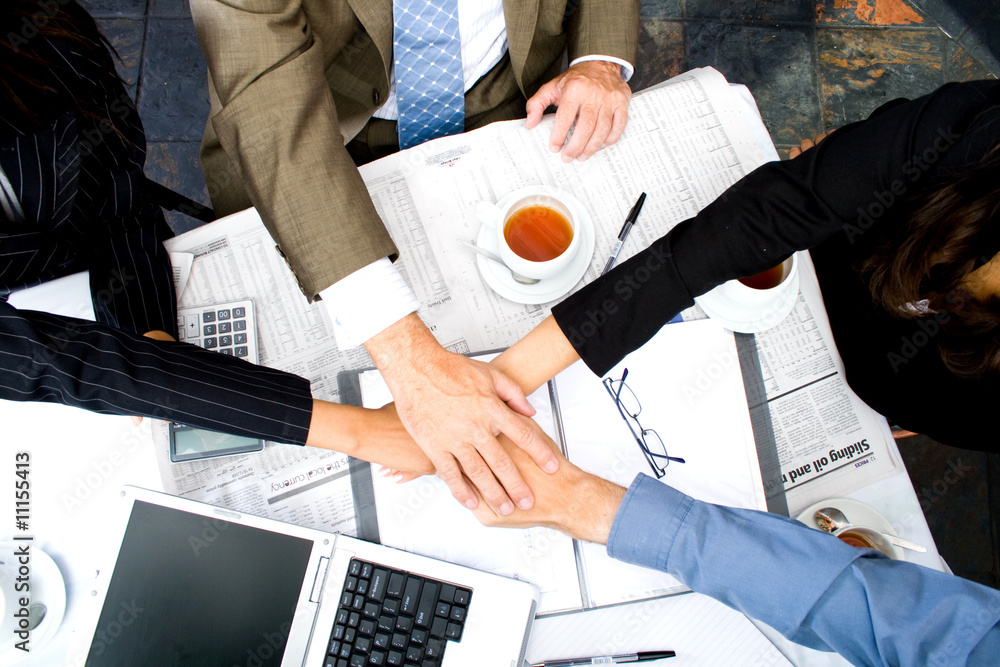 overhead view of business team hands together Stock Photo | Adobe Stock
