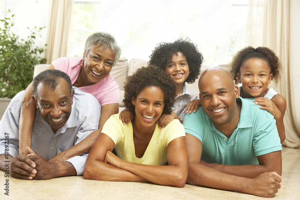 Extended Family Relaxing At Home Together Stock Photo | Adobe Stock