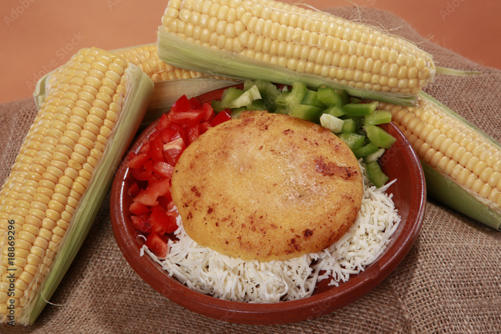Arepa de choclo - Latino corn dough muffin - cheese filling Stock Photo ...