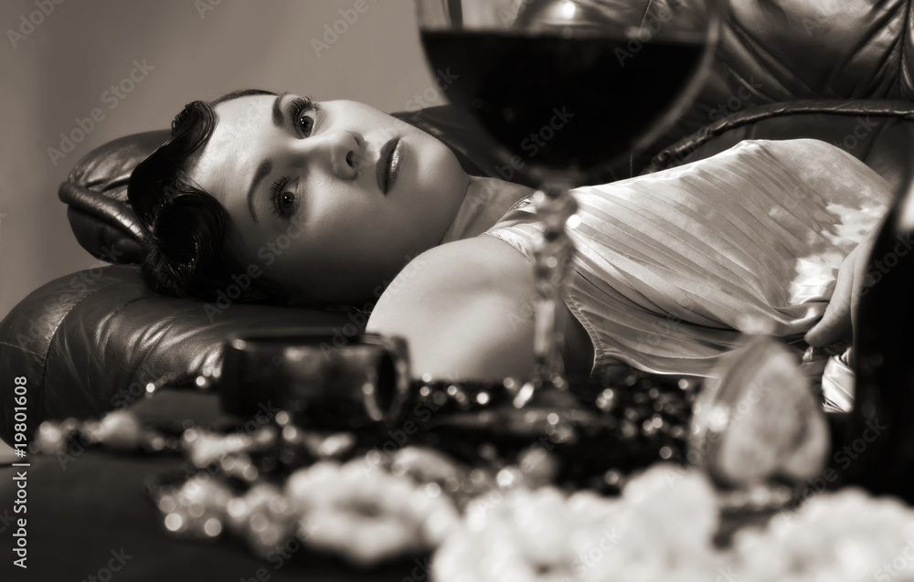 Dead woman lying on the sofa. Studio shot in a retro style Stock Photo ...