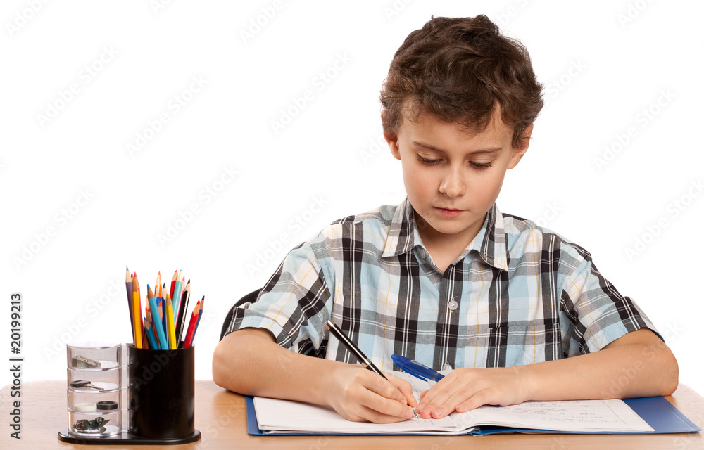Schoolboy doing homework Stock Photo | Adobe Stock