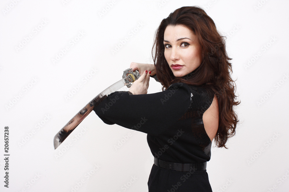 Beautiful woman wielding a samurai sword. Stock Photo | Adobe Stock