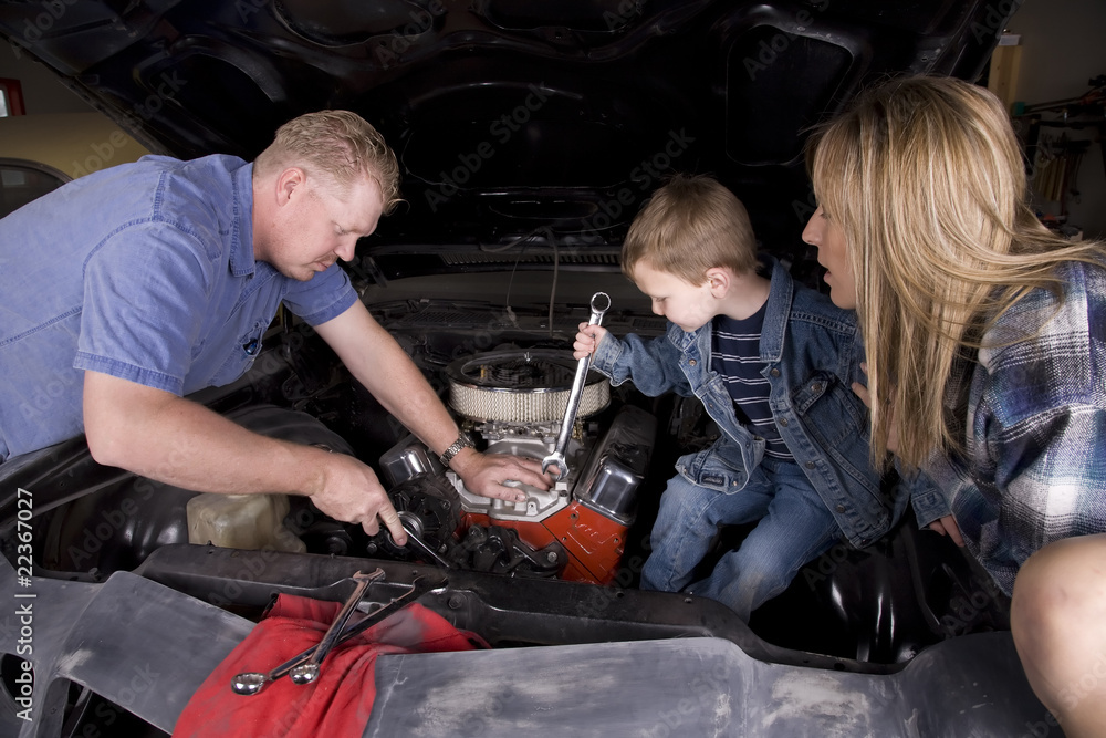 family working on car Stock Photo | Adobe Stock