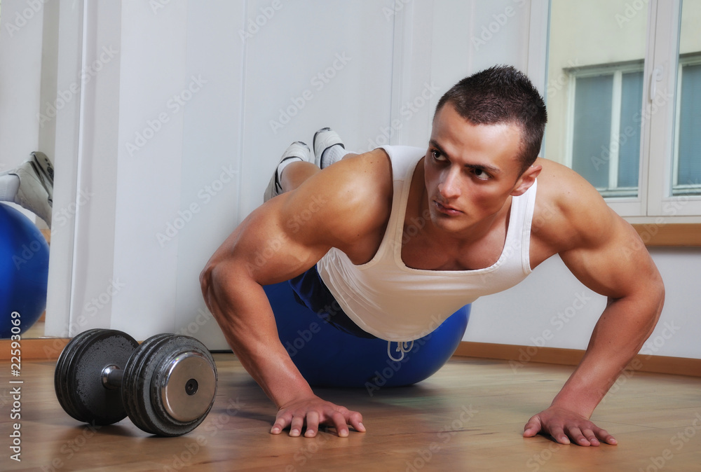 Muscle man doing push-ups Stock Photo | Adobe Stock