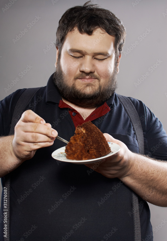 funny fat guy eating chocolate cake Stock Photo | Adobe Stock