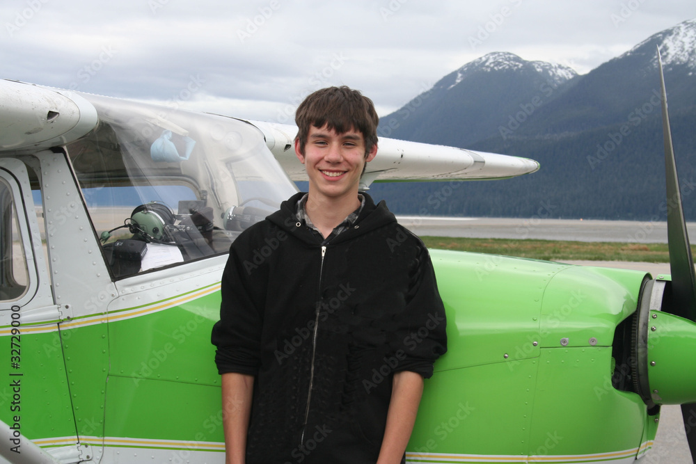 Teenage Boy with Small Airplane Stock Photo | Adobe Stock