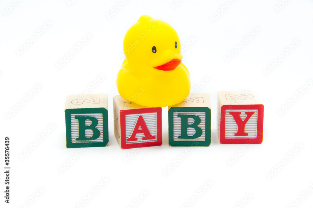 Baby Alphabet Blocks and Yellow Bathtub duck の Stock フォト | Adobe Stock