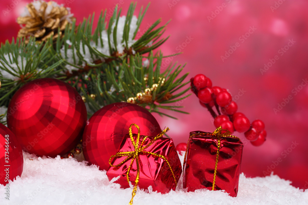 Christmas ball and green tree in the snow on red Stock Photo | Adobe Stock