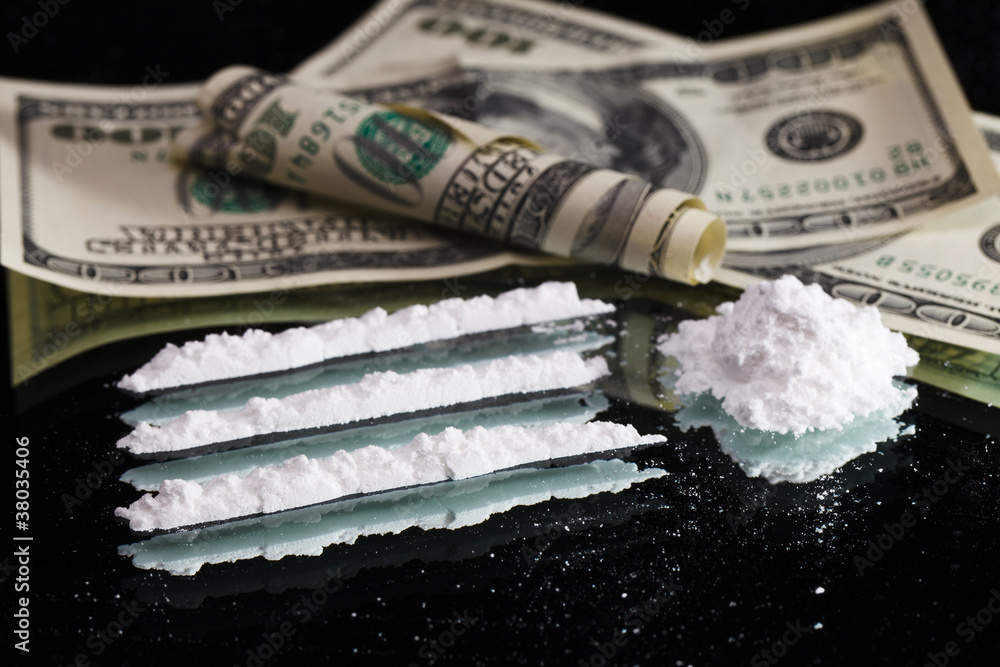 Cocaine drugs heap still life on a mirror with rolled 100 dollar Stock ...