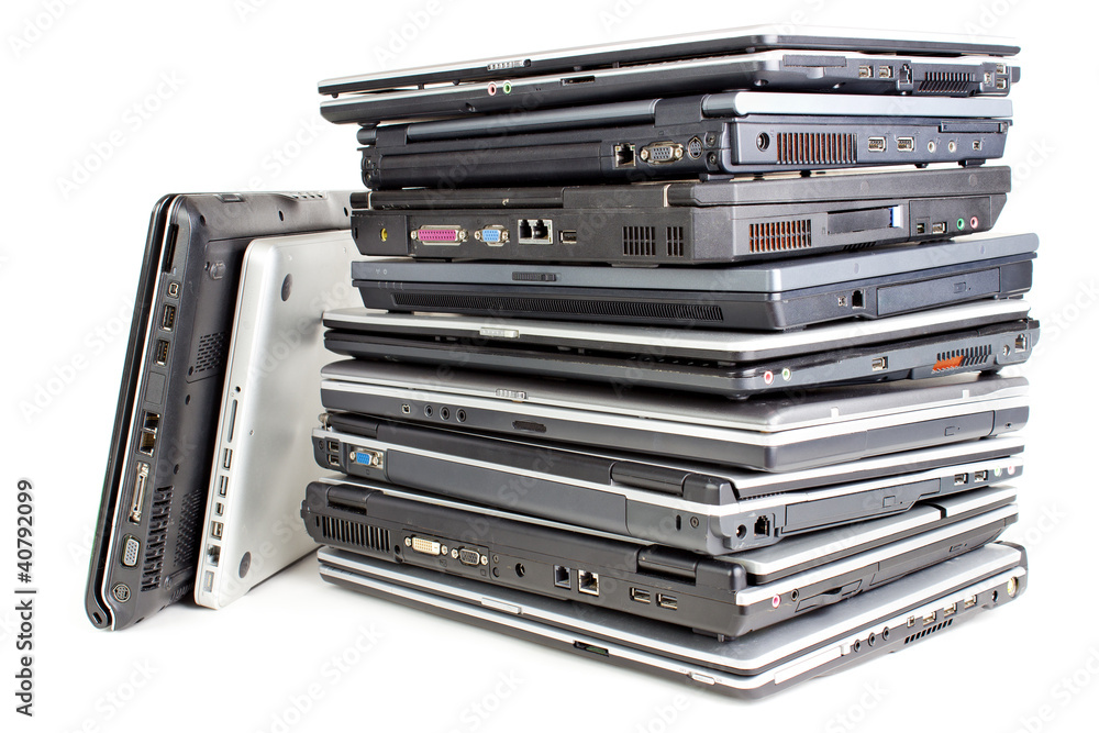 Pile of used laptops, white background Stock Photo | Adobe Stock