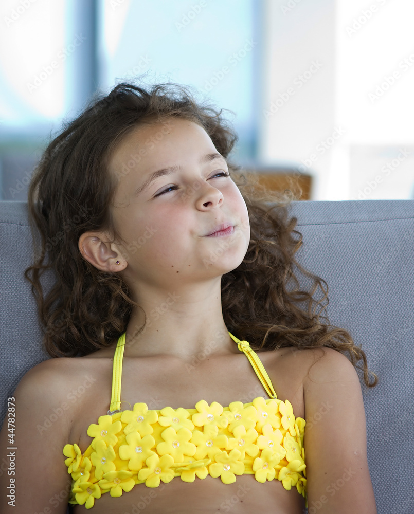 Portrait of a beautiful young girl in a yellow bikini Stock Photo ...