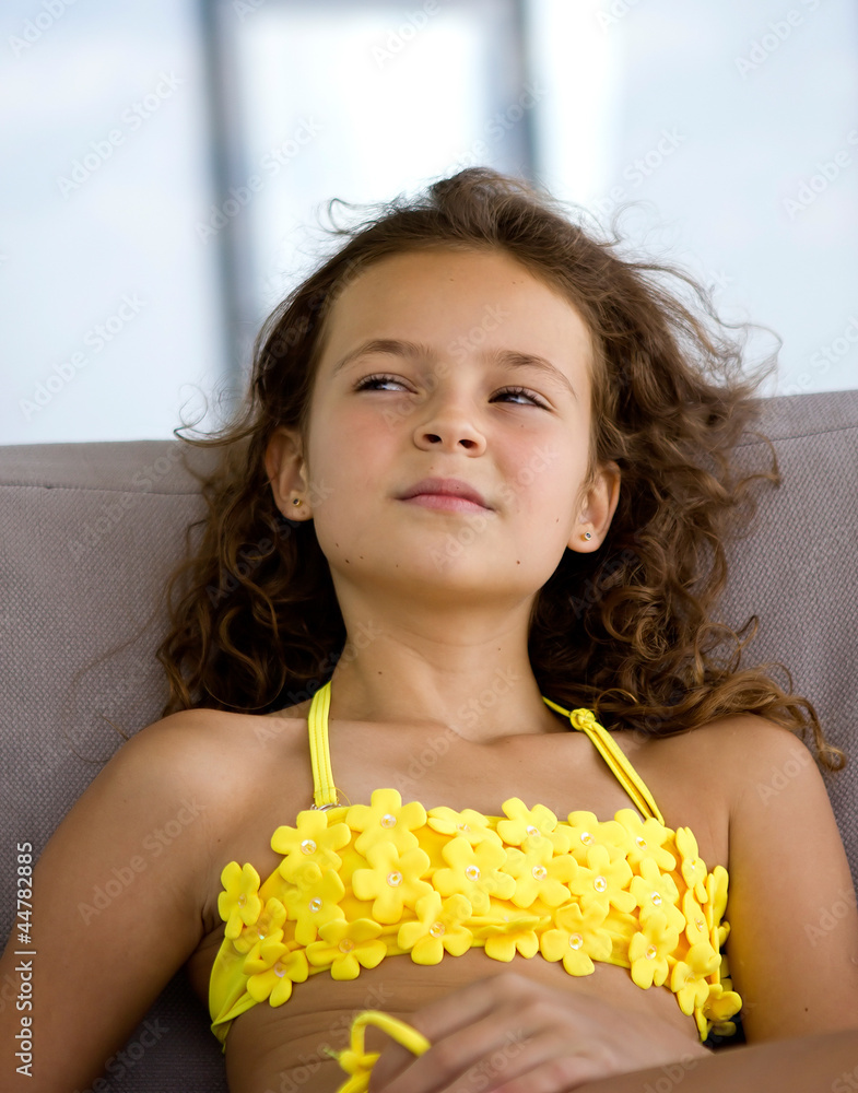 Portrait of a beautiful young girl in a yellow bikini Stock Photo ...