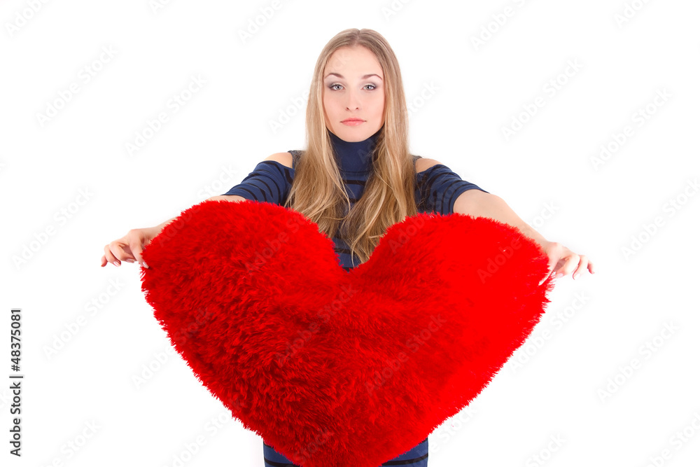 Young beautiful girl hugs a big soft heart Stock Photo | Adobe Stock