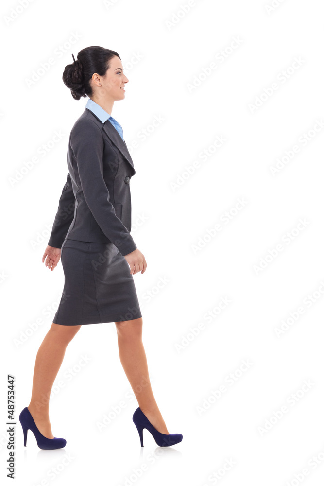 Side view of a business woman walking Stock Photo | Adobe Stock