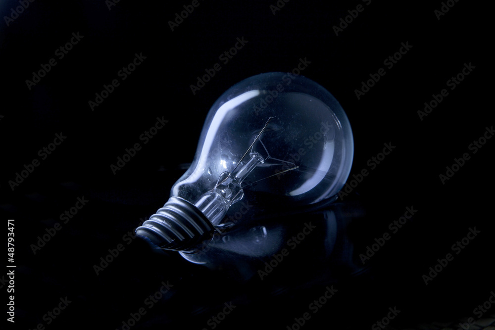 light bulb floating on water with low key light effect in studio Stock ...