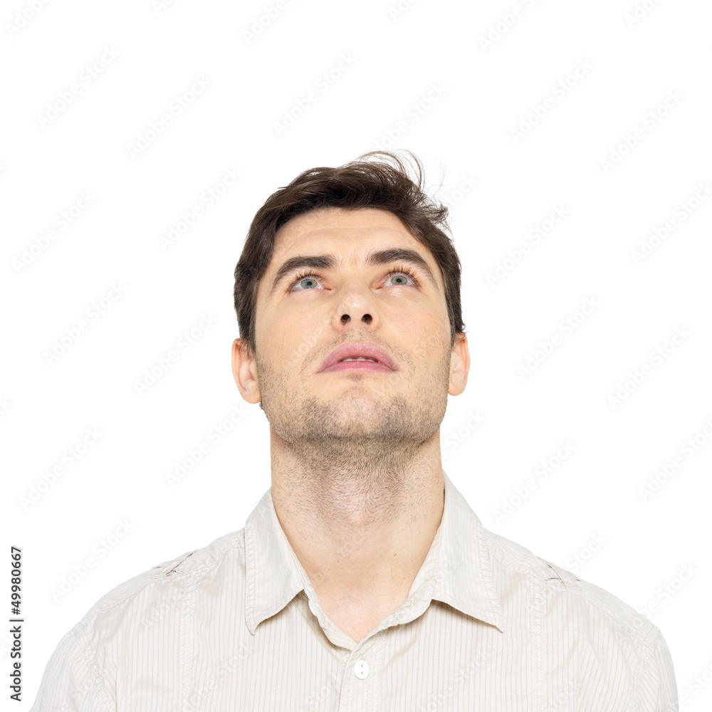 Portrait of young man looking up Stock Photo | Adobe Stock