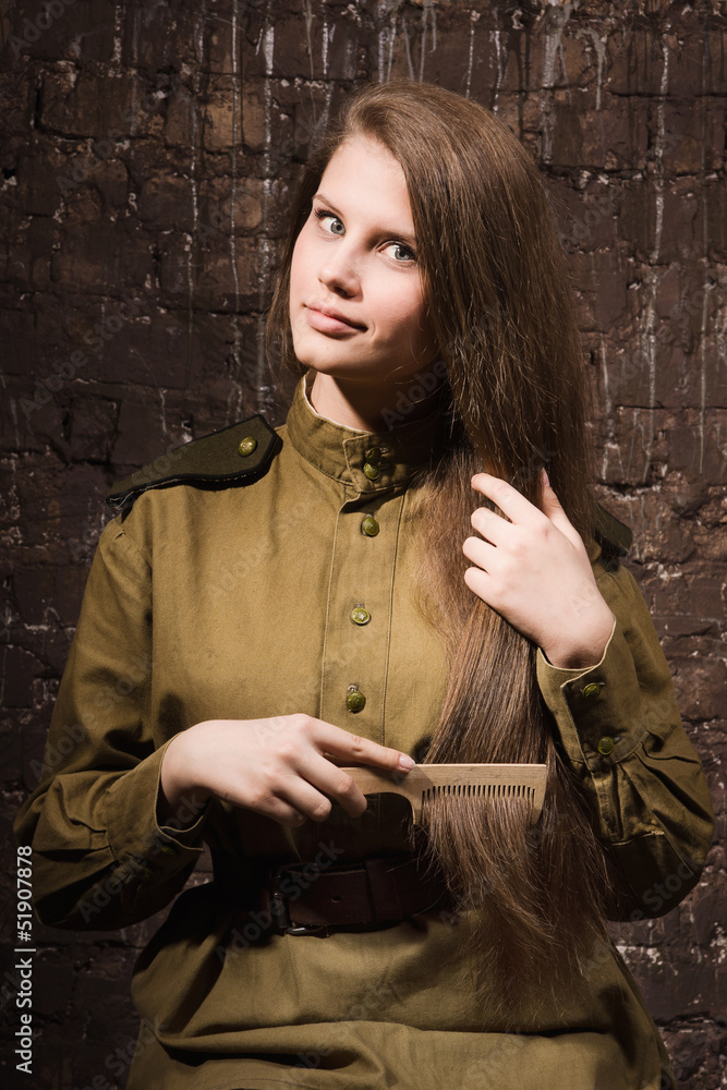 Foto de Stock Soviet female soldier in uniform of World War II combs ...