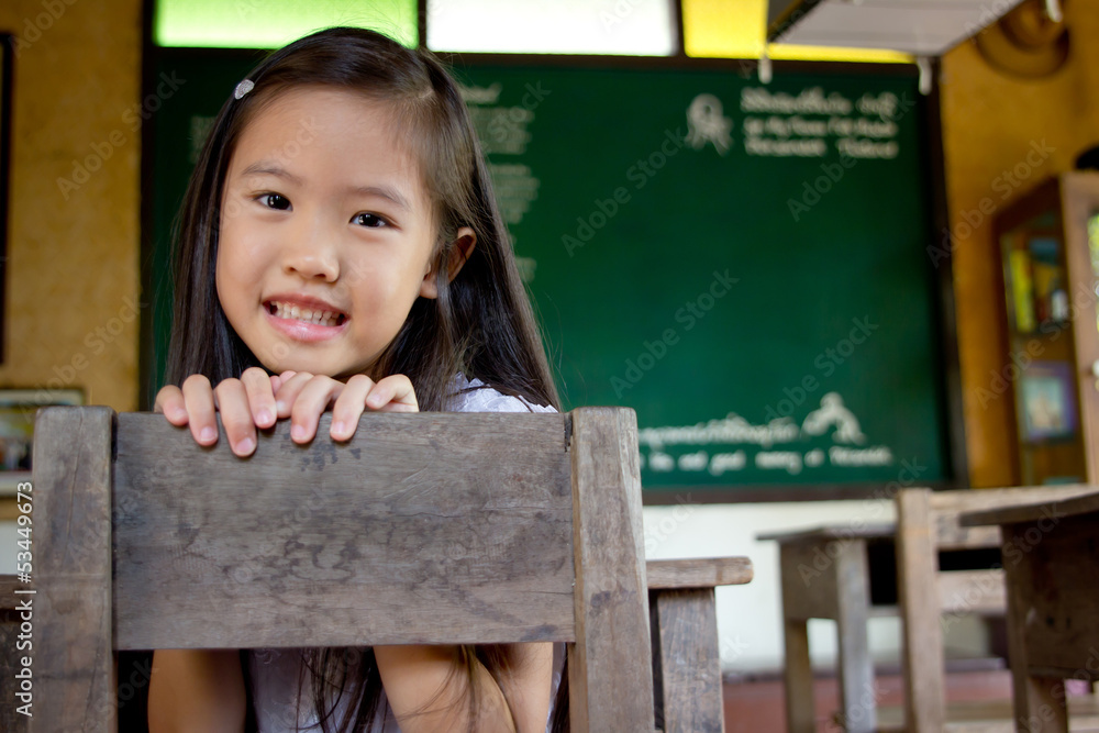 Smiley asian girl in the classroom Stock Photo | Adobe Stock