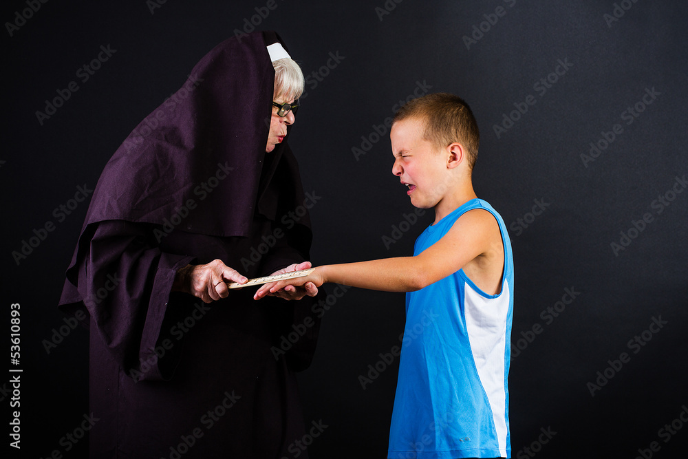 Nun hitting child with a ruler Stock Photo | Adobe Stock