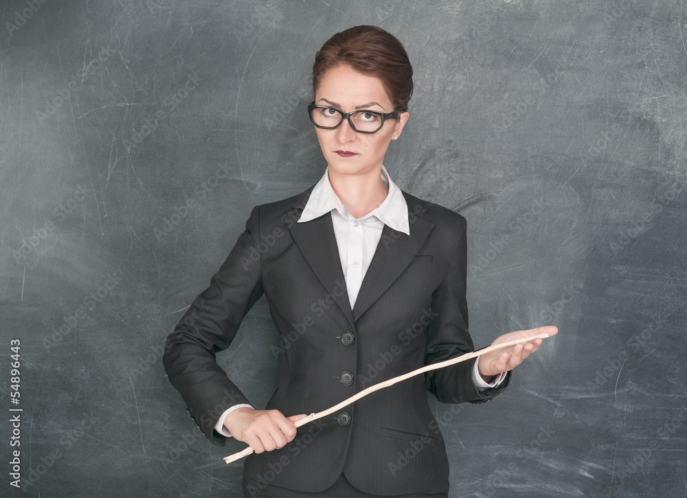 Strict teacher with wooden stick Stock Photo | Adobe Stock