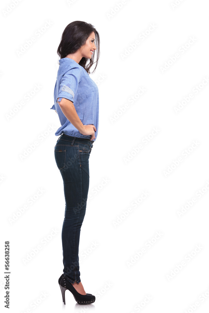 side of a casual woman with hands on hips Stock Photo | Adobe Stock