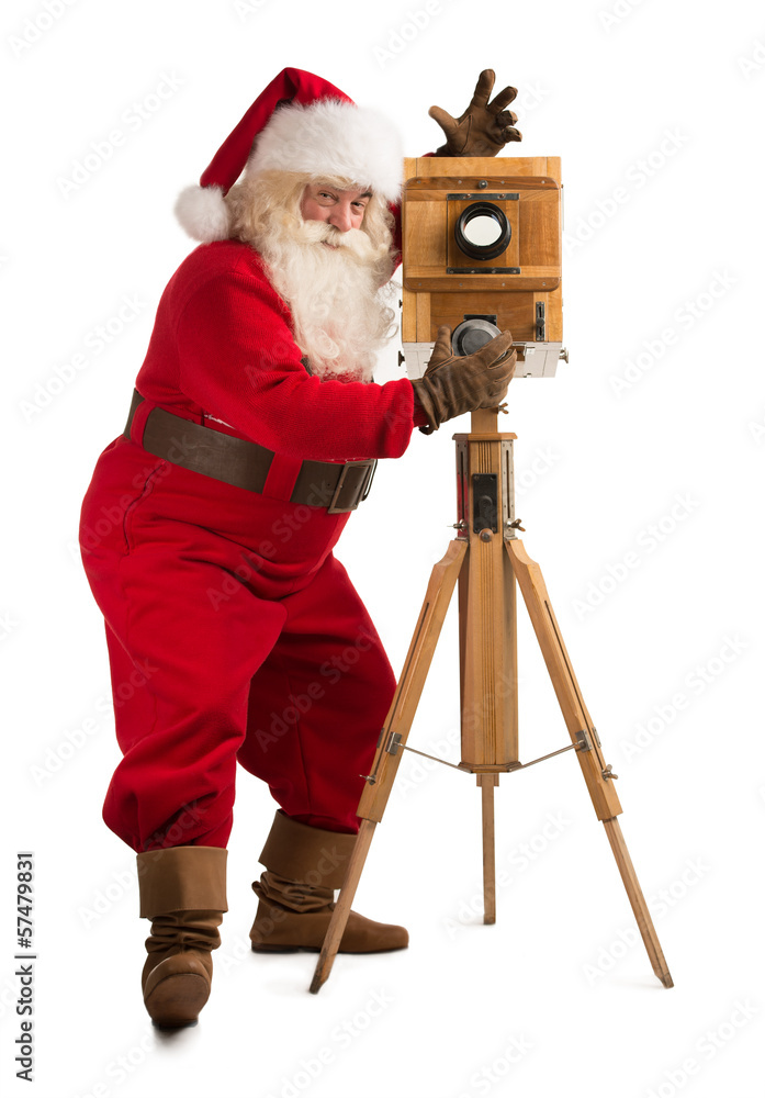 Santa Claus taking picture with old wooden camera Stock Photo | Adobe Stock