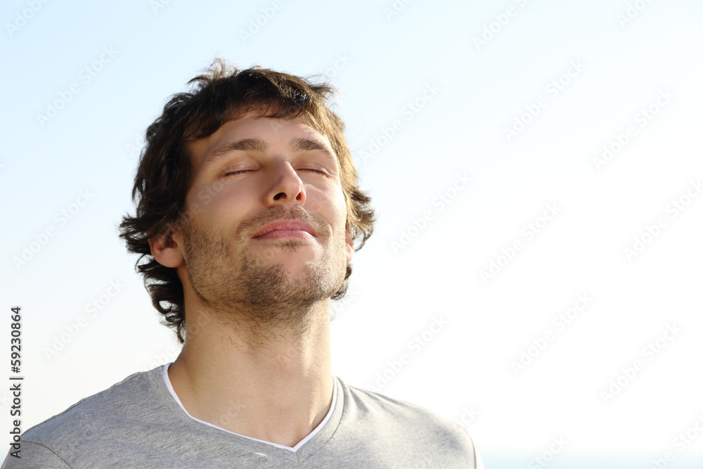 Attractive man breathing outdoor Stock Photo | Adobe Stock