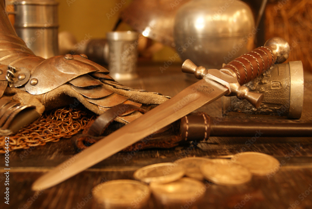 Medieval dagger on old table Stock Photo | Adobe Stock