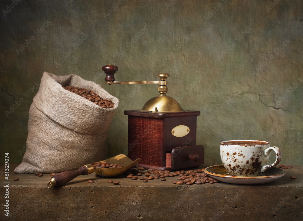 Still life with cup of coffee and grinder Stock Photo | Adobe Stock