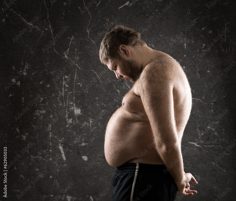 Fat man profile view on grungy background Stock Photo | Adobe Stock