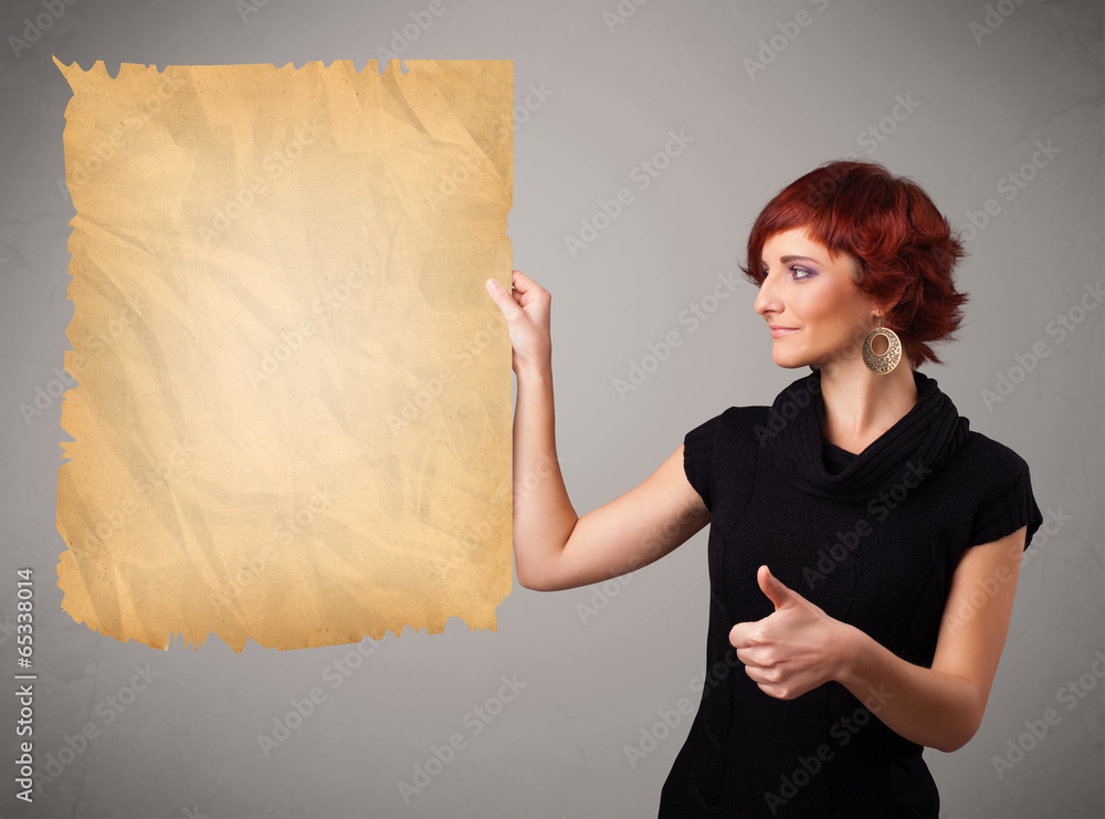 Young girl presenting old paper copy space Stock Photo | Adobe Stock