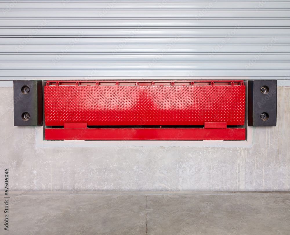 Dock leveler or height adjustable platform outside warehouse or ...