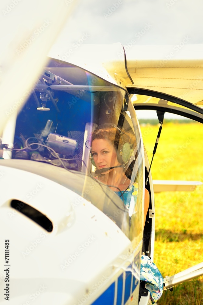 Beautiful woman in dress pilot in cockpit of ultralight plane Stock ...