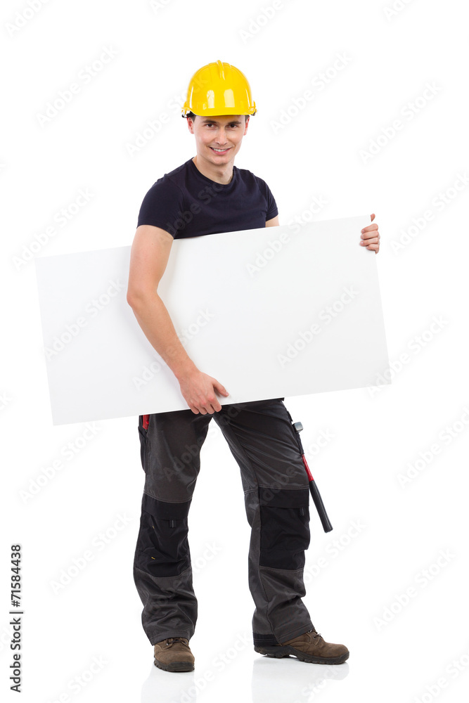 Manual worker carrying blank baner under his arm Stock Photo | Adobe Stock