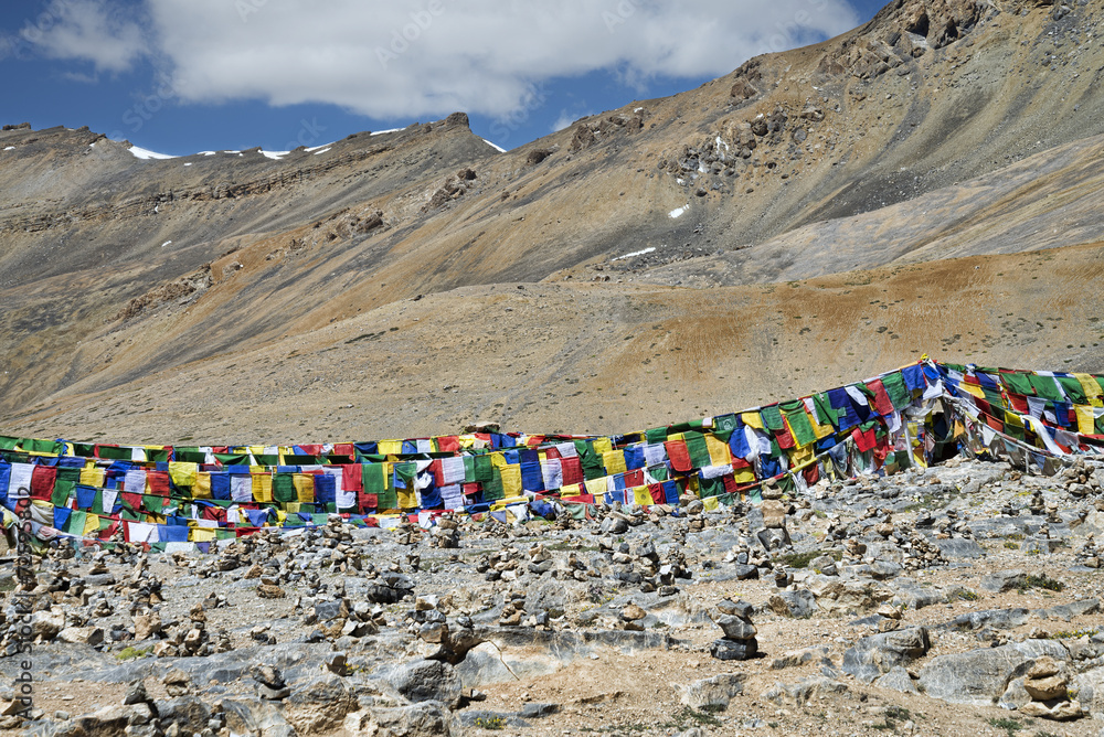 Colorful buddhist flags and lot of stone pyramids Stock Photo | Adobe Stock