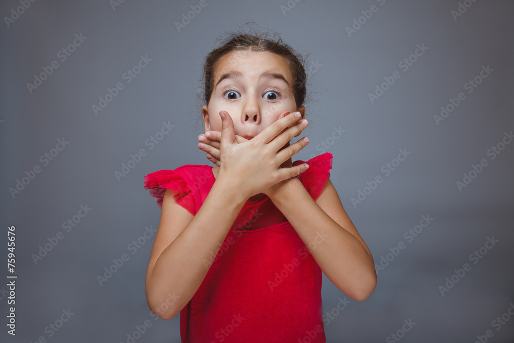 Teen girl child hands covering her mouth feels fright shock on a Stock ...