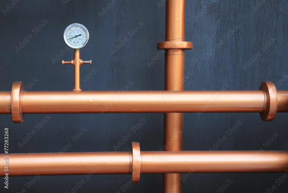 Pressure gauge meter installed on copper pipes Stock Photo | Adobe Stock