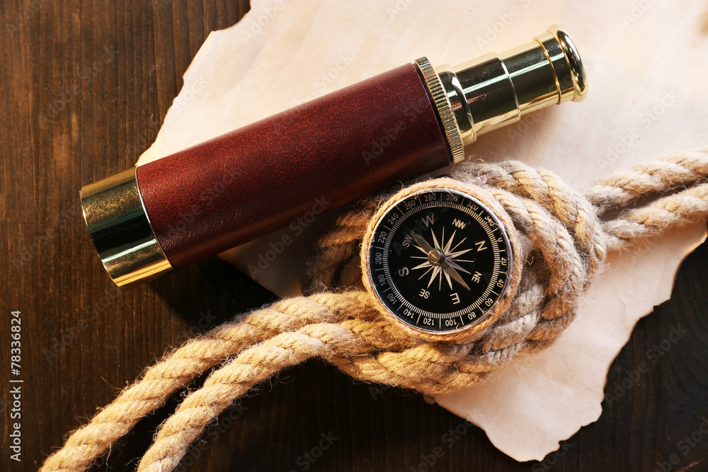 Marine still life spyglass, compass rope and sheet of paper Stock Photo ...