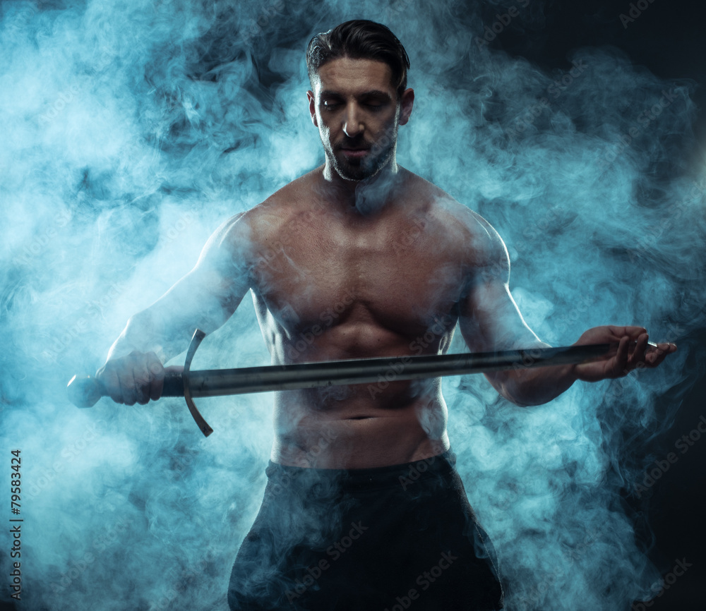 Gorgeous Shirtless Muscled Man Holding a Sword Stock Photo | Adobe Stock