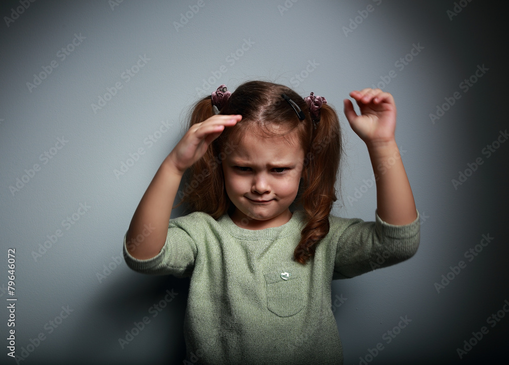 Angry kid girl moving the hands on dark background Stock Photo | Adobe ...