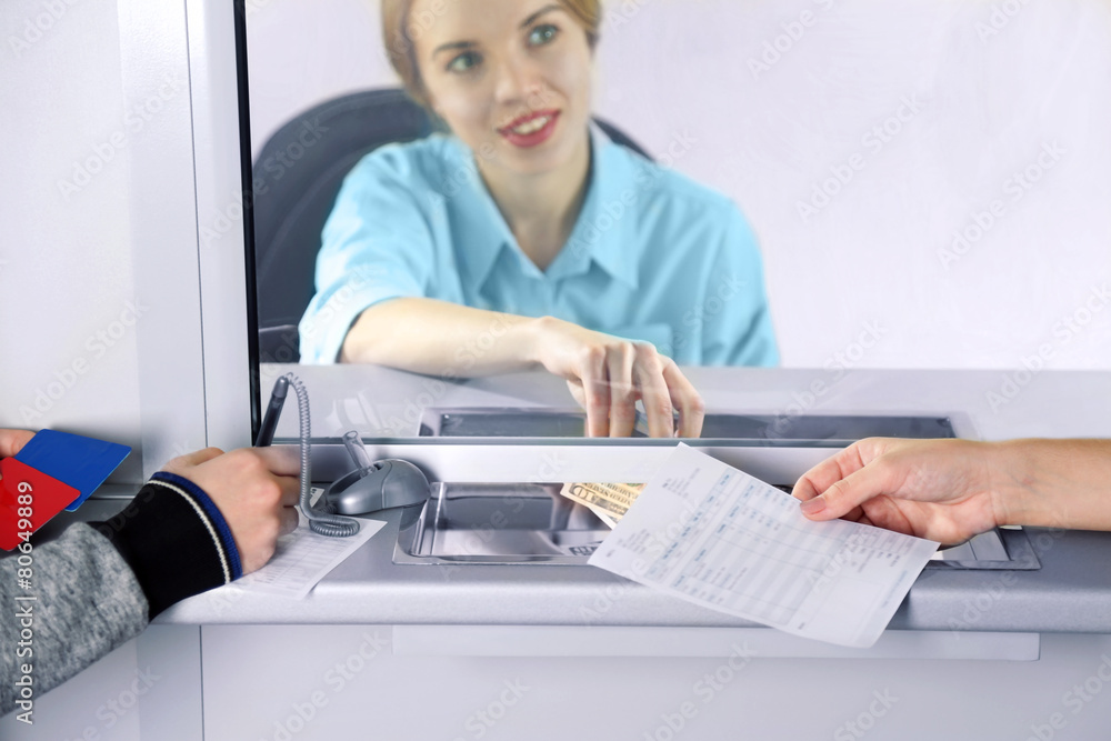 Teller window with working cashier 素材庫相片 | Adobe Stock