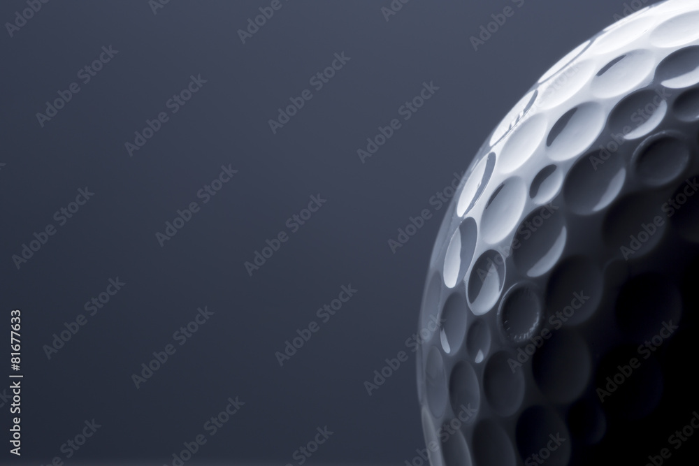 Stylish golf ball isolated on empty dark blue background. Stock Photo ...