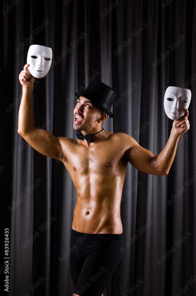 Muscular actor with theatrical mask Stock Photo | Adobe Stock
