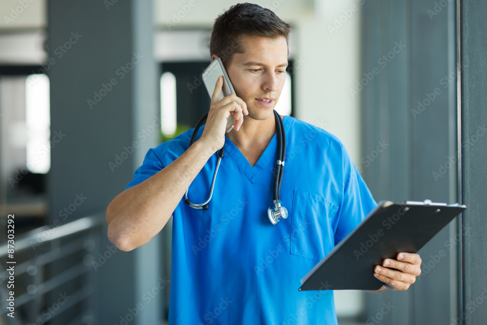 medical doctor talking on mobile phone Stock Photo | Adobe Stock