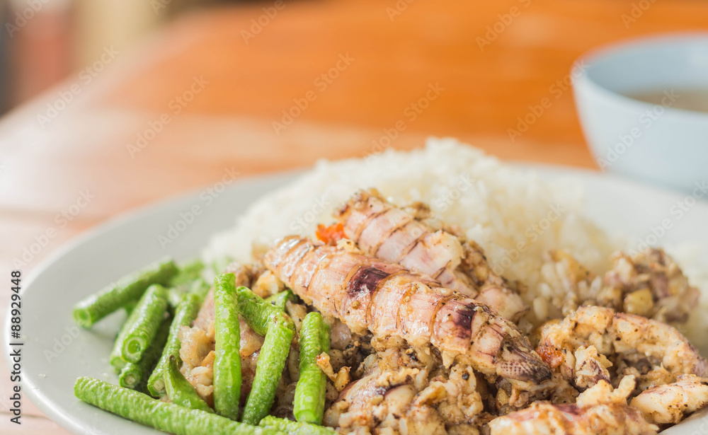 Crayfish with garlic and served with hot rice. Stock Photo | Adobe Stock