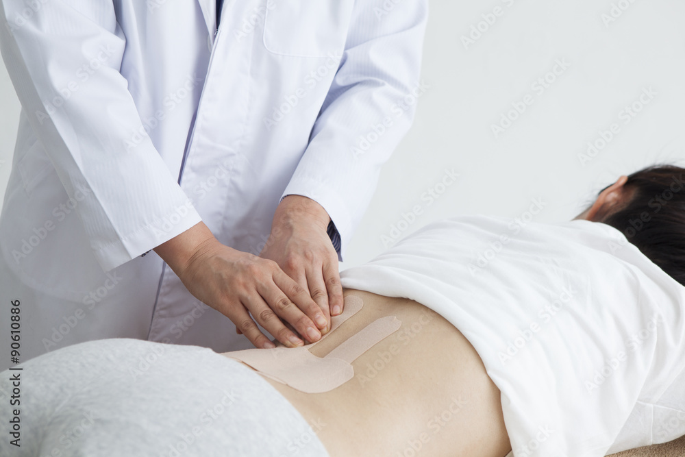 Manipulative nurses have an inspection of low back pain Stock Photo ...