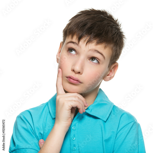 Portrait of the thinking teen boy in casuals Stock Photo | Adobe Stock