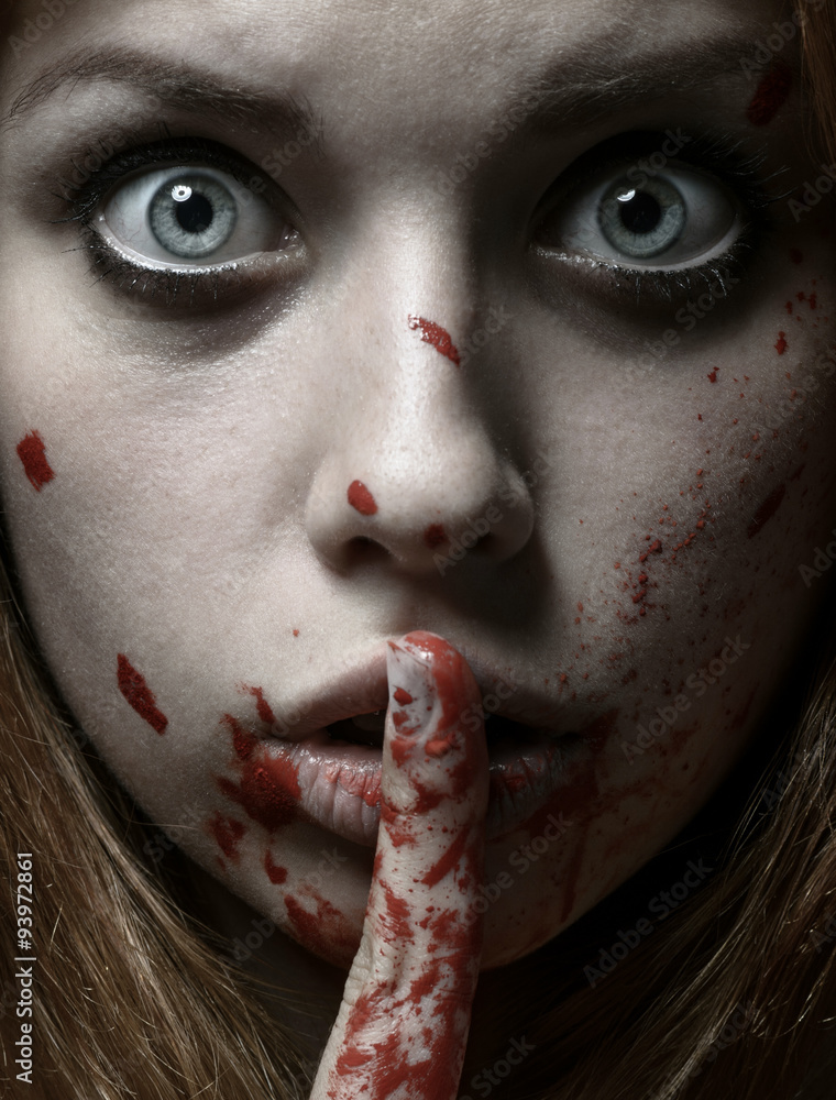 Scary Girl and Halloween theme: portrait of a crazy girl with a bloody ...